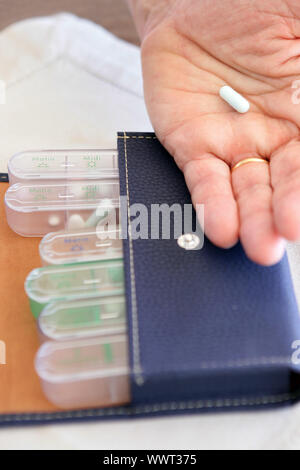 Daily medicine drug organizing box Stock Photo - Alamy