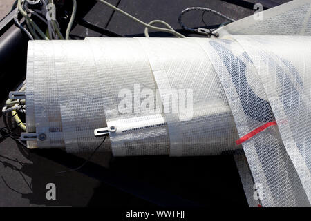 Fiber sail rolled detail macro texture on sailing marina Stock Photo ...