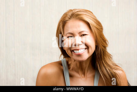 Pretty ethnic woman with an easy smile Stock Photo - Alamy