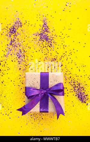 Flat lay with gift box wrapped in craft paper Stock Photo - Alamy