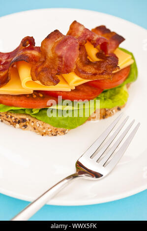 Bacon Lettuce and Tomato BLT open faced sandwich on a bread roll on ...