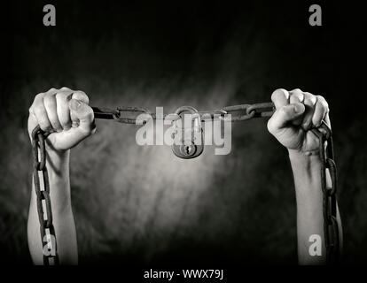 Man holding old rusty chain with a lock in his hands Stock Photo - Alamy