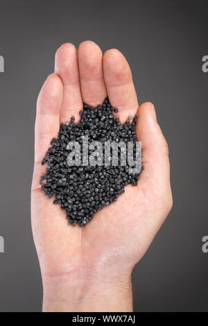 Granular recycled black plastic Stock Photo - Alamy