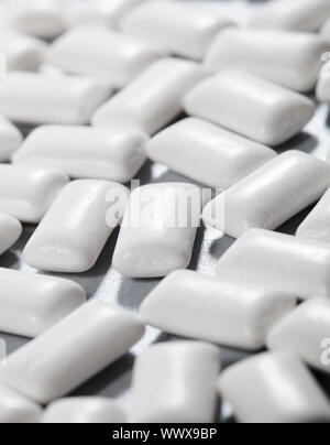 Rectangular white chewing gum on grey Stock Photo - Alamy
