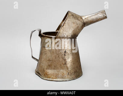 Old dented metallic oil can Stock Photo - Alamy