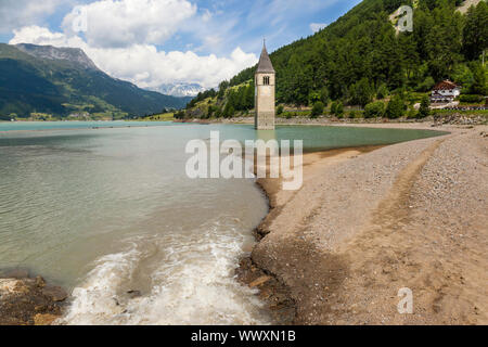 The old church tower of Reschen in the reservoir Lake Reschen, Italy ...