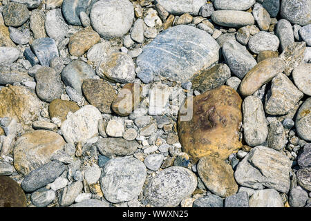 Nice background image of pebbles, round rocks texture Stock Photo - Alamy