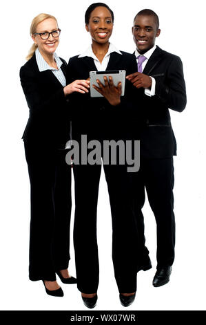 Technology savvy business team using tablet pc. Business concept Stock ...
