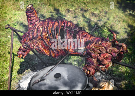 Fried on a fire carcass of a RAM Stock Photo - Alamy