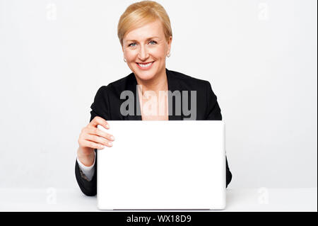 Secretary holding laptop flap, about to close. Isolated on white ...