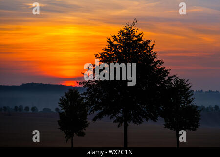 Twilight rising sun first rays of light Stock Photo - Alamy