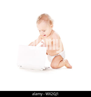 A tanned Caucasian baby in a white diaper is laughing and smiling ...