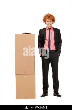 picture of attractive businessman with big boxes Stock Photo - Alamy