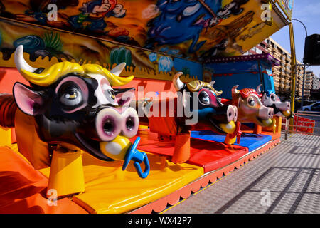 Outdoor vintage flying cow carousel Stock Photo - Alamy