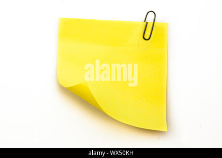 Sticky note with grey paperclip against a white background Stock Photo ...
