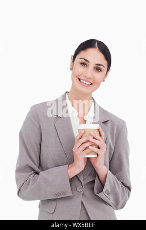 Happy adult woman with paper cup of coffee on pink background Stock ...