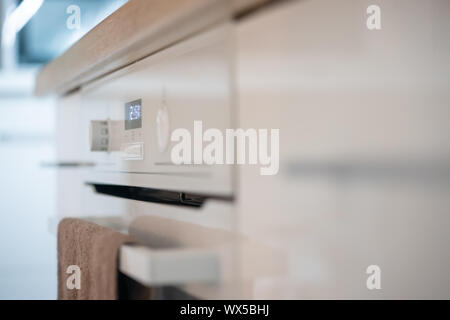 Modern kitchen surface of new electrical stove with clock indicator and ...