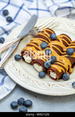 Crepes filled with chocolate and cottage cheese. Party deesert Stock ...