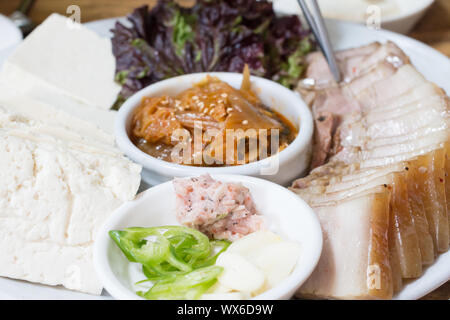 Korean traditional food bossam, boiled pork eaten with a salty sauce ...