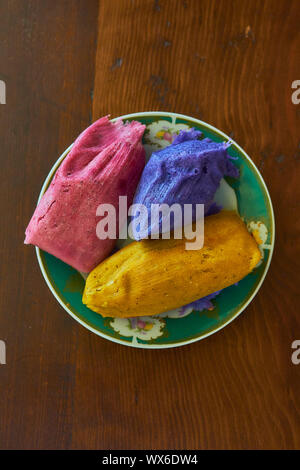 Corn tamales in colors, traditional Mexican food, sweet and chili ...