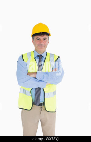 Cheerful man in high visibility vest and gloves talking to multiethnic ...