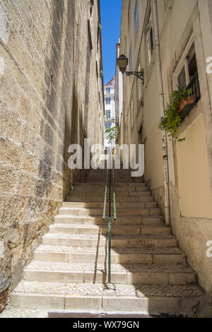 stone stairs between the building, old walls, concrete footbridge to ...