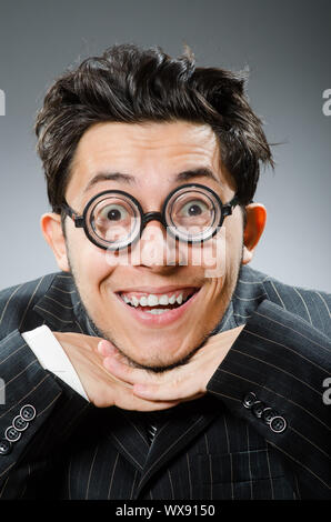 Funny nerd businessman in dark studio Stock Photo - Alamy