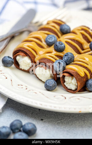 Crepes filled with chocolate and cottage cheese. Party dish Stock Photo ...
