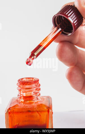 pipette with ink isolated on white background Stock Photo - Alamy