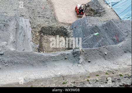 slab concrete and rebar iron for slope reinforcement at an excavation ...