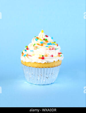 Single iced cupcake with colorful sprinkles Stock Photo - Alamy