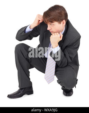 Young businessman in defensive pose afraid of something isolated on ...