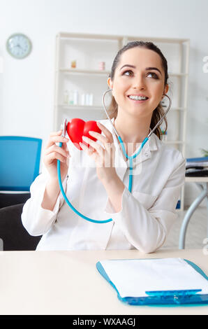Young female doctor cardiologist working in the clinic Stock Photo - Alamy