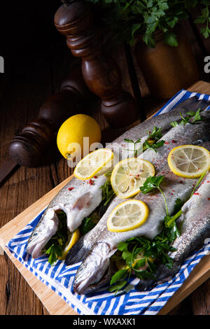 fresh trout with lemon and different herbs Stock Photo - Alamy