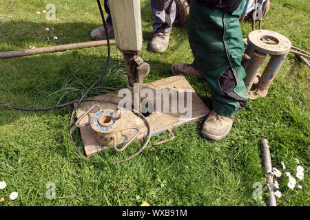 Earth drilling for a soil sample Stock Photo - Alamy
