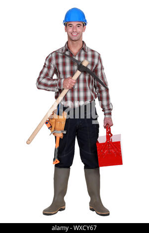 craftsman holding a pick Stock Photo - Alamy