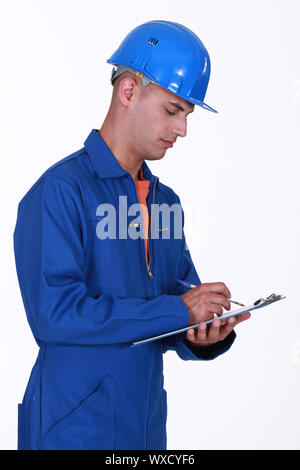 Happy Construction Worker Guy Taking Notes Holding Folder, Studio Shot ...