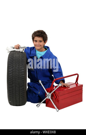 Little boy mechanic on white background Stock Photo - Alamy