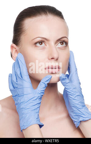 Beautician touch and exam health woman face. Plastic surgery. Isolated ...
