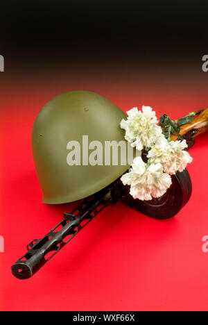 Machine Gun And Flowers Stock Photo - Alamy