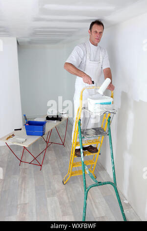 Painter working on project alone Stock Photo - Alamy