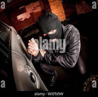 robber and the thief hijacks the car Stock Photo - Alamy