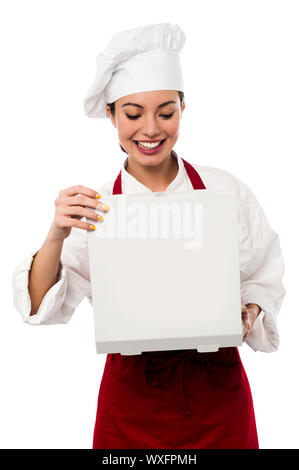 Young beautiful chinese chef woman wearing cooker uniform and hat ...