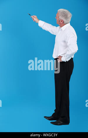 Man pointing to an invisible object Stock Photo - Alamy