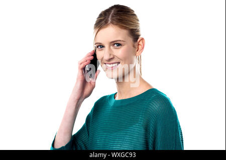 Pretty teenager talking to her boyfriend through cellphone Stock Photo ...