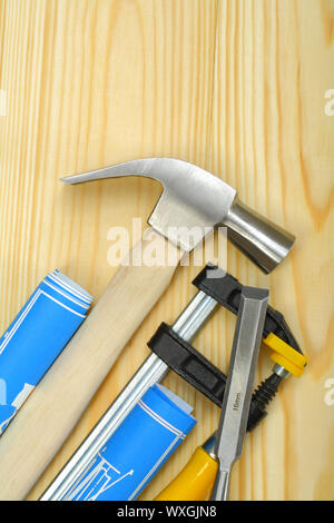 hammer and carpenter vise with chisel blueprints Stock Photo - Alamy