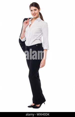 Businesswoman, blazer slung over her shoulder Stock Photo - Alamy