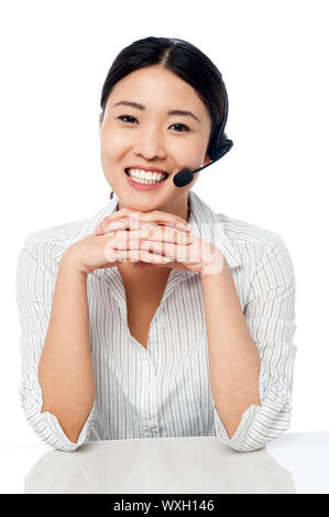 Beautiful help-desk female executive isolated over white Stock Photo ...