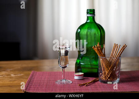 Typical Dutch drink jenever with salted sticks Stock Photo - Alamy