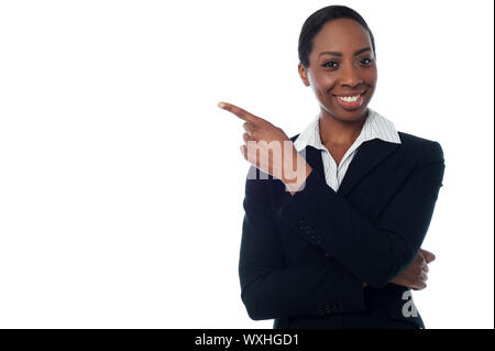 Experienced female executive pointing away Stock Photo - Alamy